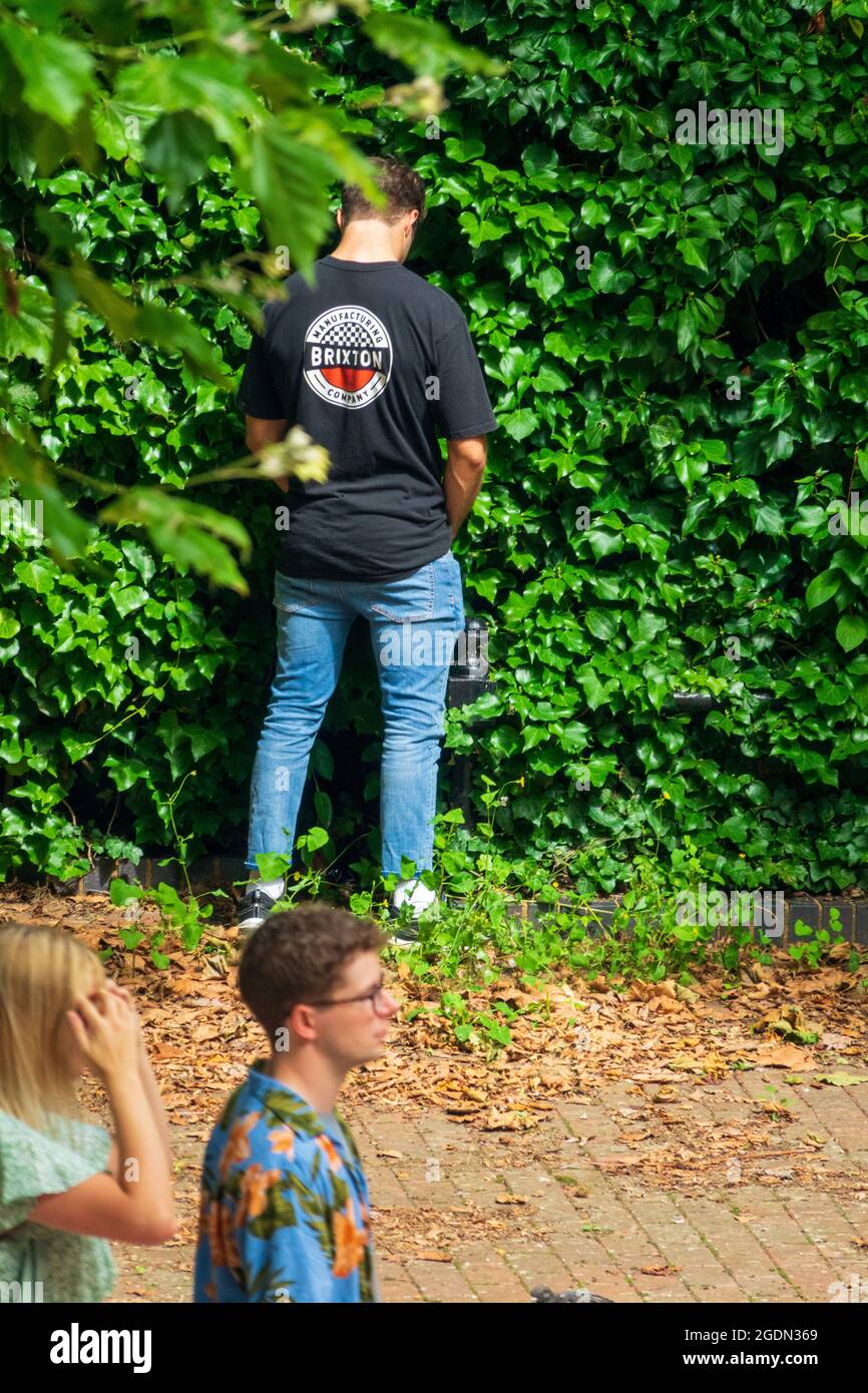 A man urinating in public at the London Craft Beer Festival 2021 Stock ...
