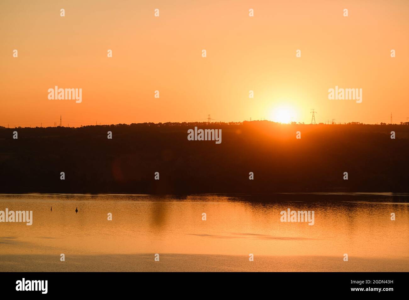 Beautiful calm view of water and orange sun at horizon, scenic nature ...