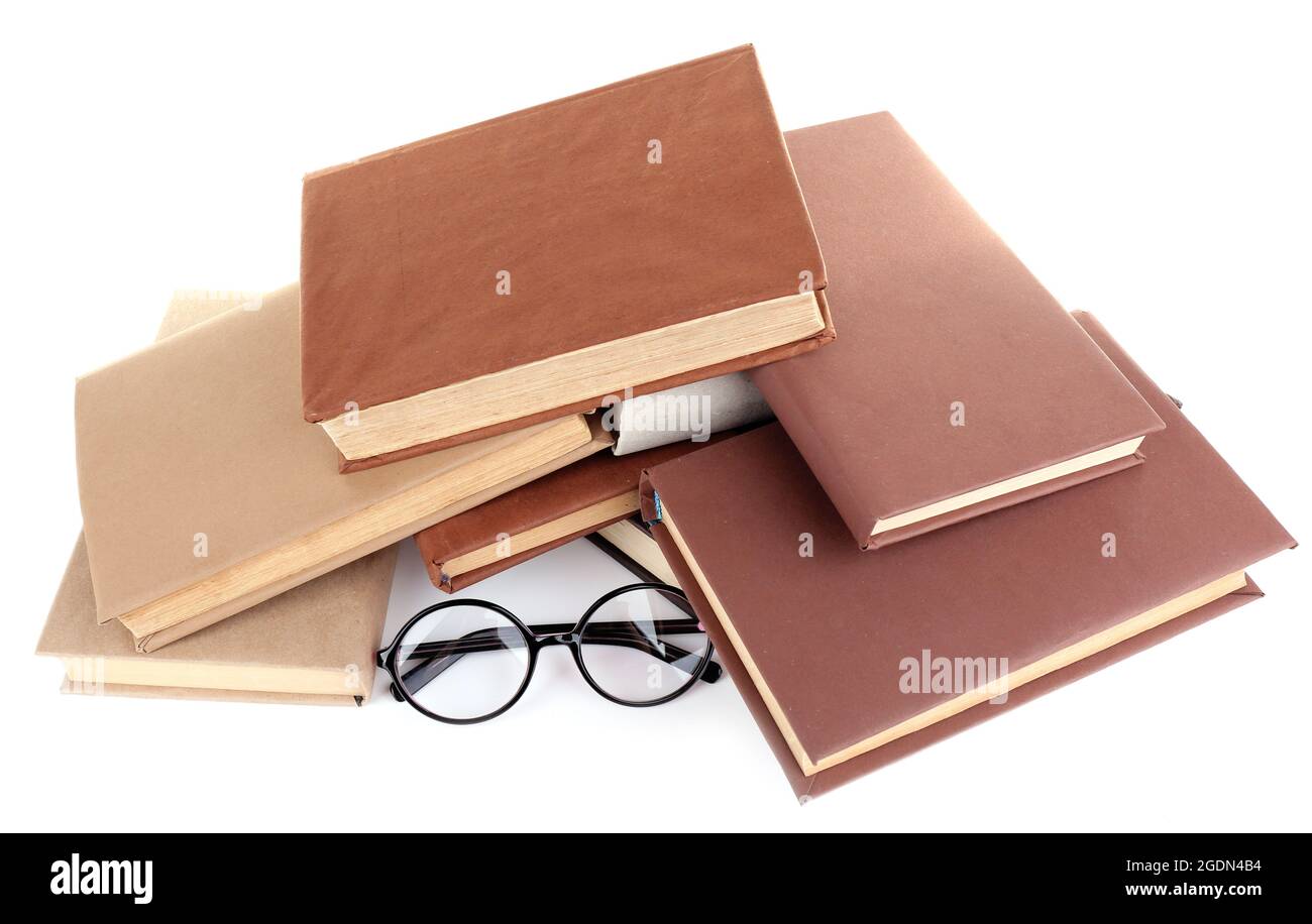 Books in a mess and glasses isolated on white Stock Photo - Alamy