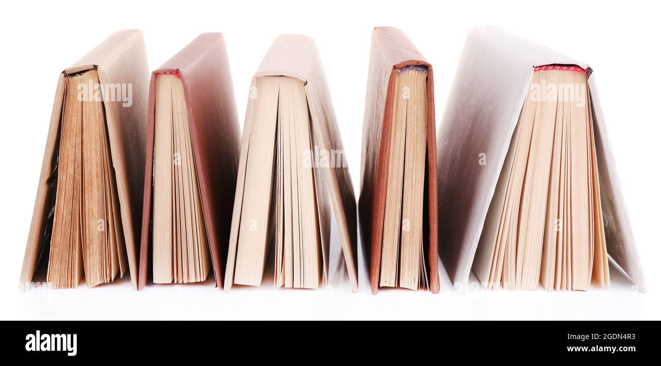 Books in a mess isolated on white Stock Photo - Alamy