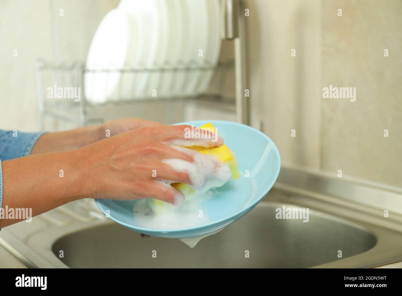 Concept of dishwashing on kitchen basin background Stock Photo - Alamy