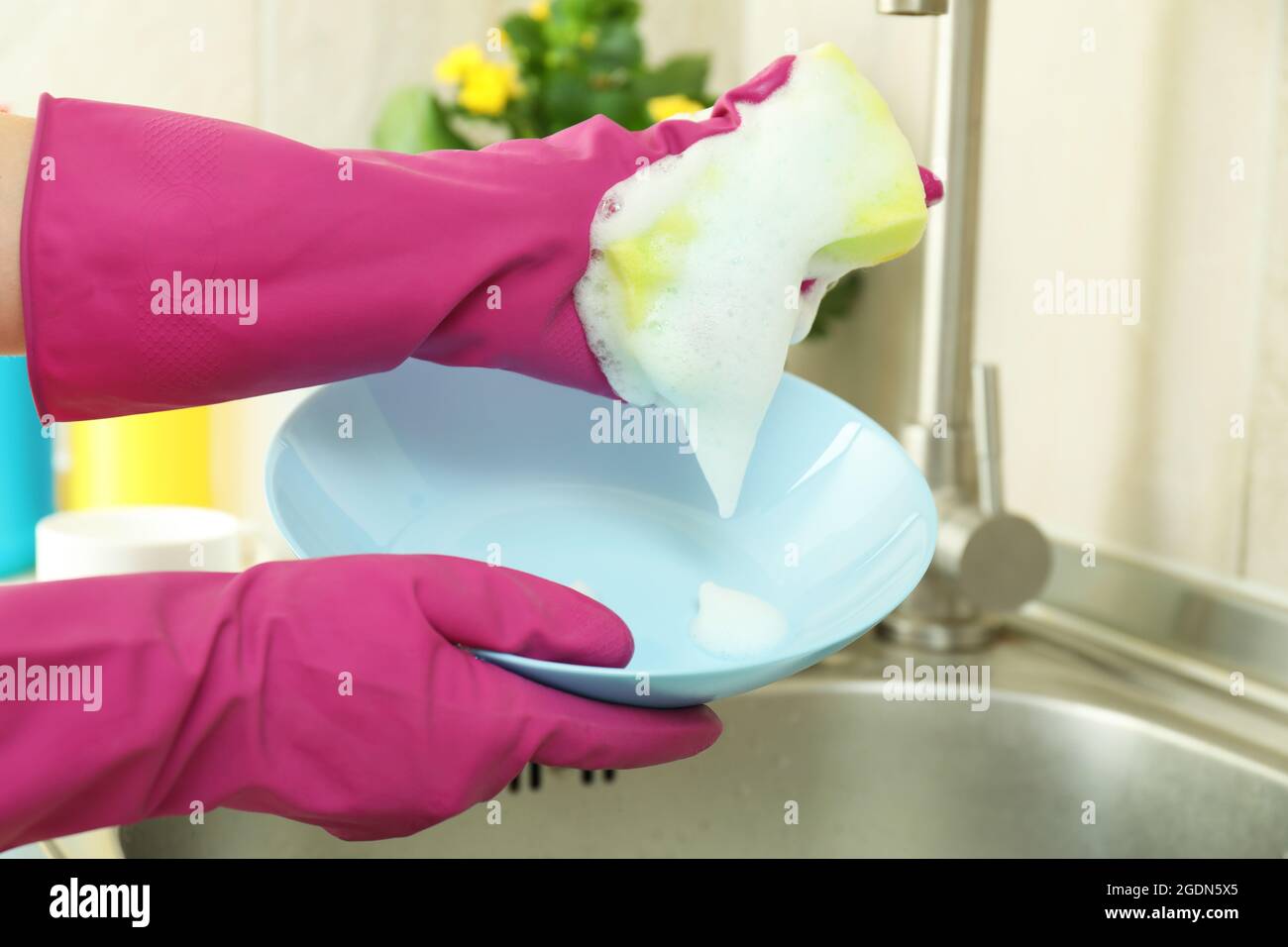 Concept of dishwashing on kitchen basin background Stock Photo - Alamy