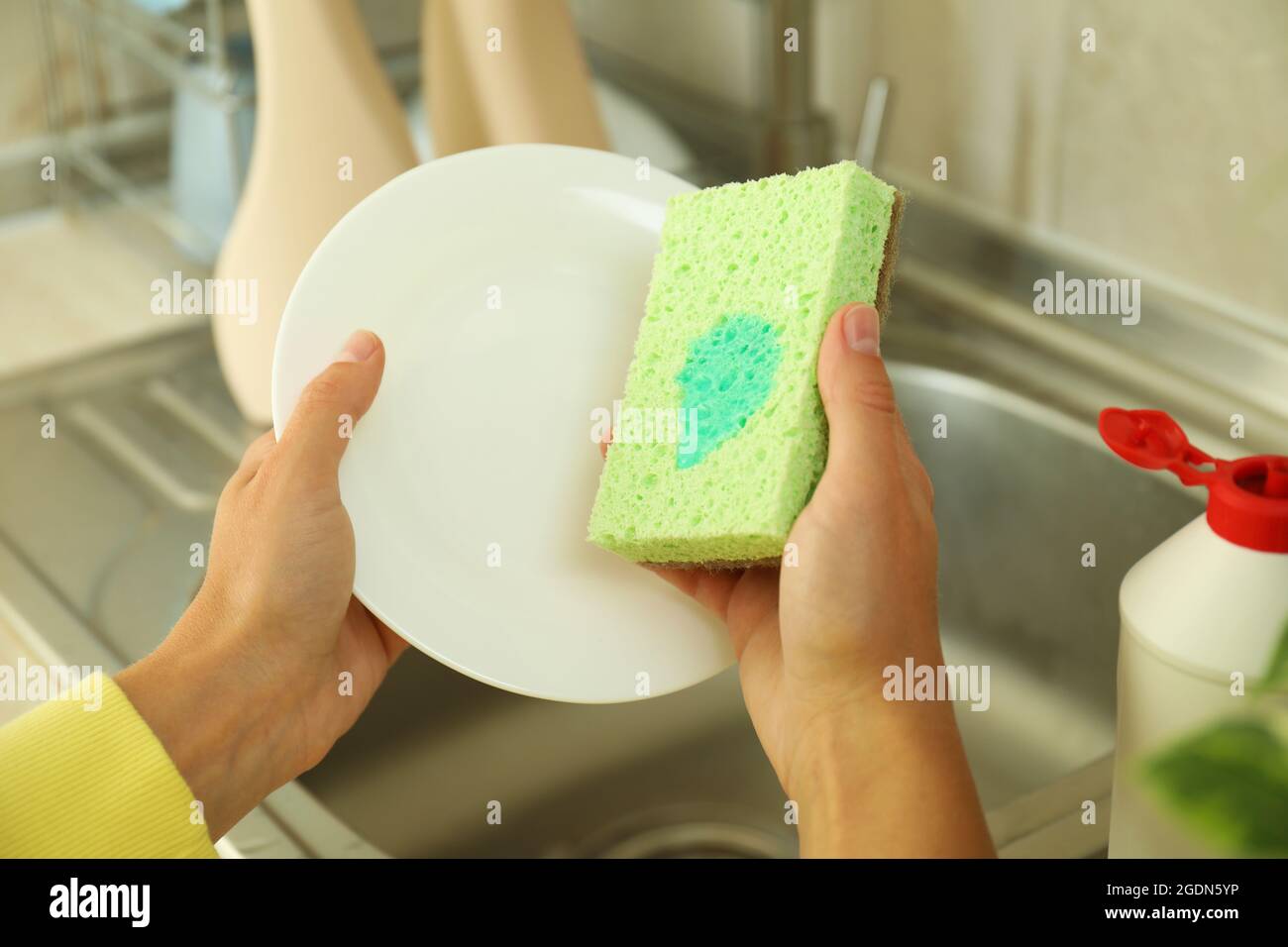 Concept of dishwashing on kitchen basin background Stock Photo - Alamy