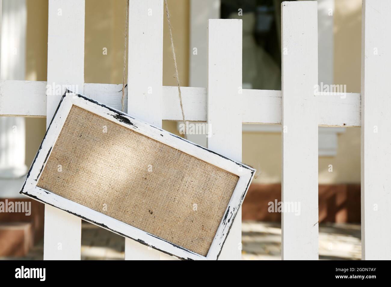 Signboard hanging on wooden fence Stock Photo - Alamy