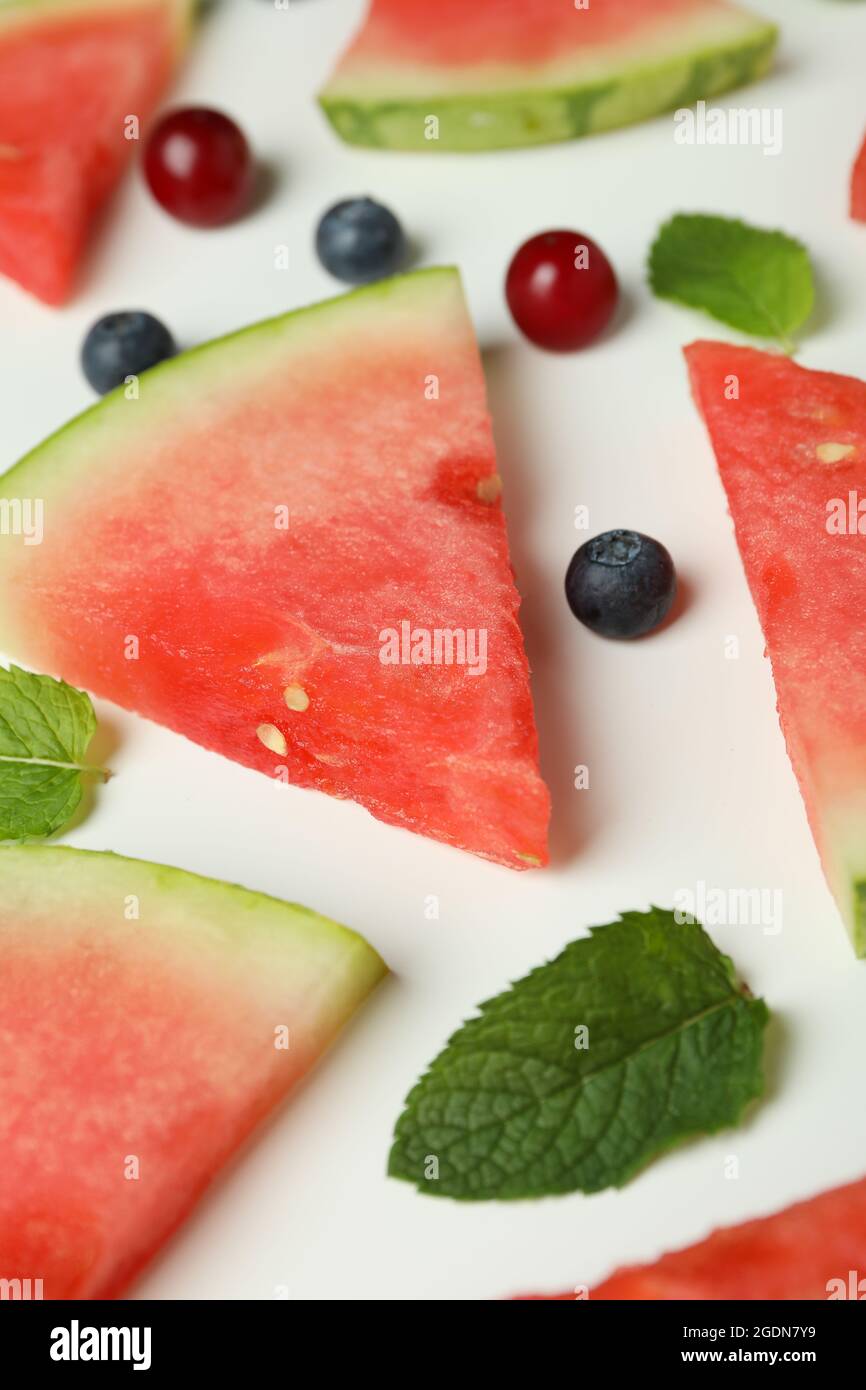 Flat lay with watermelon slices and berries on white background Stock ...
