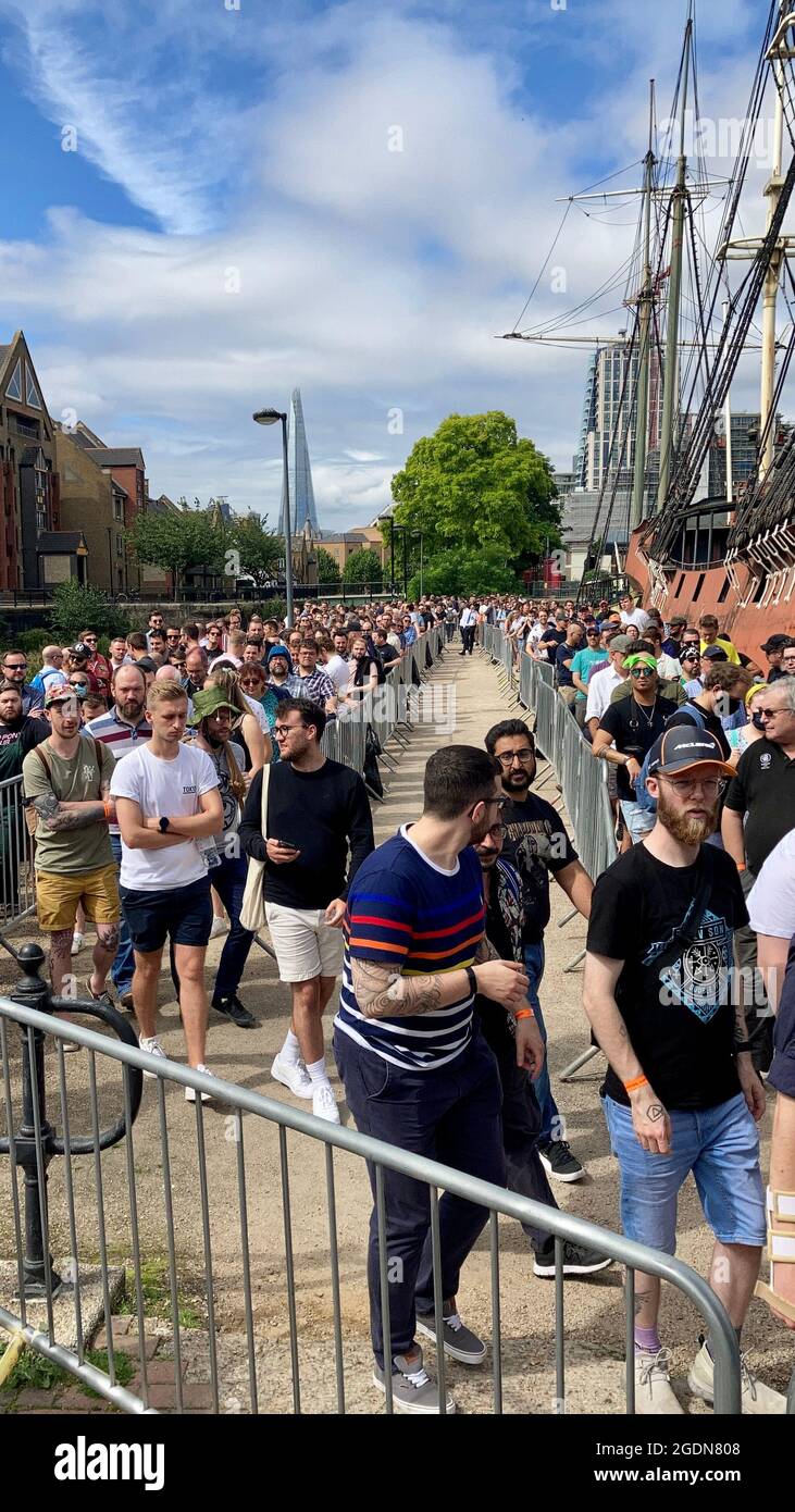 A large queue of people gathering for the London Craft Beer Festival ...