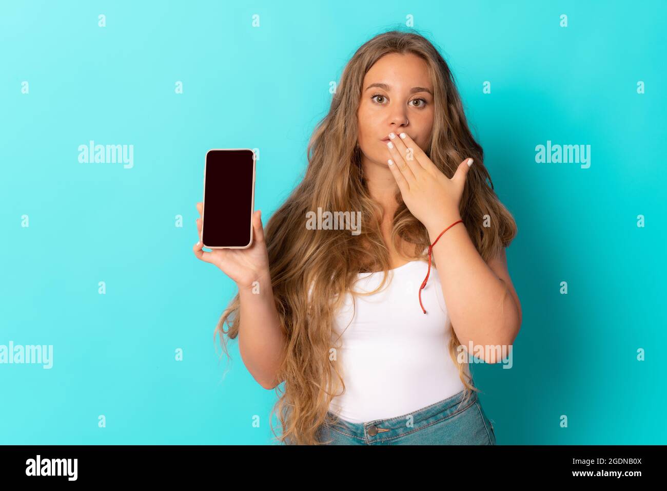 Young beautiful happy woman using smart phone. Excited surprised young ...