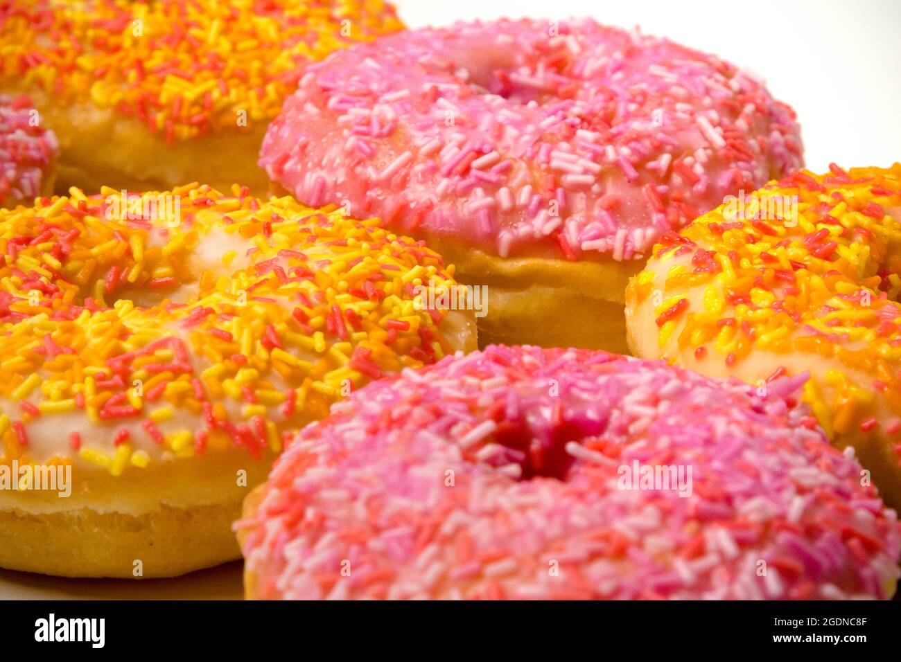 Iced Ring Donuts On A White Background Stock Photo - Alamy