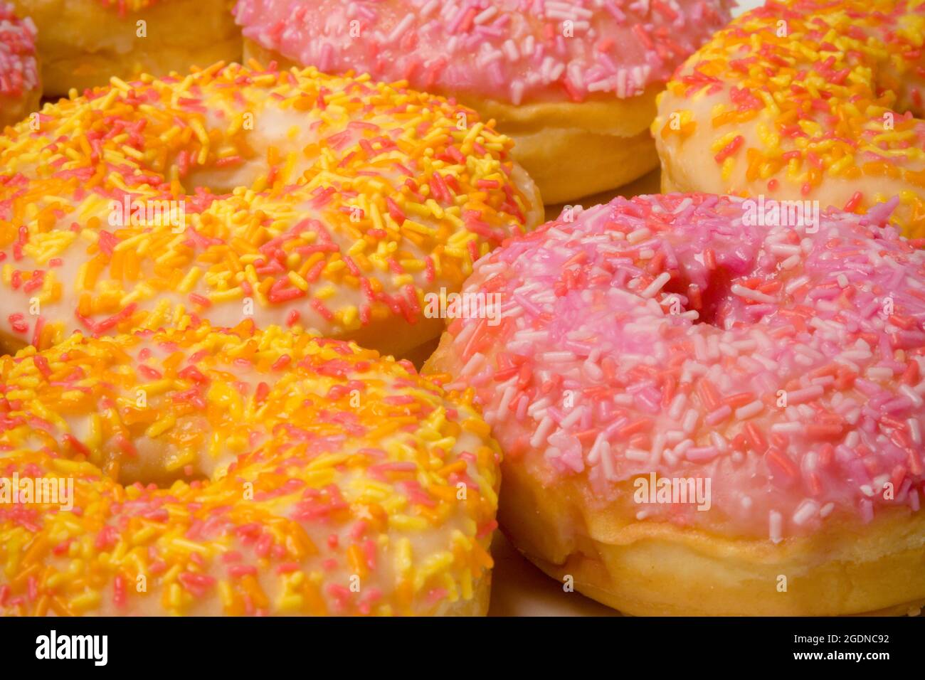 Iced Ring Donuts On A White Background Stock Photo - Alamy