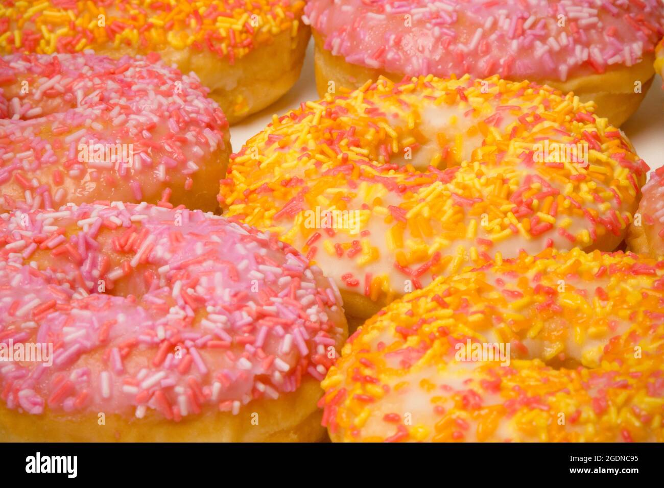 Iced Ring Donuts On A White Background Stock Photo - Alamy