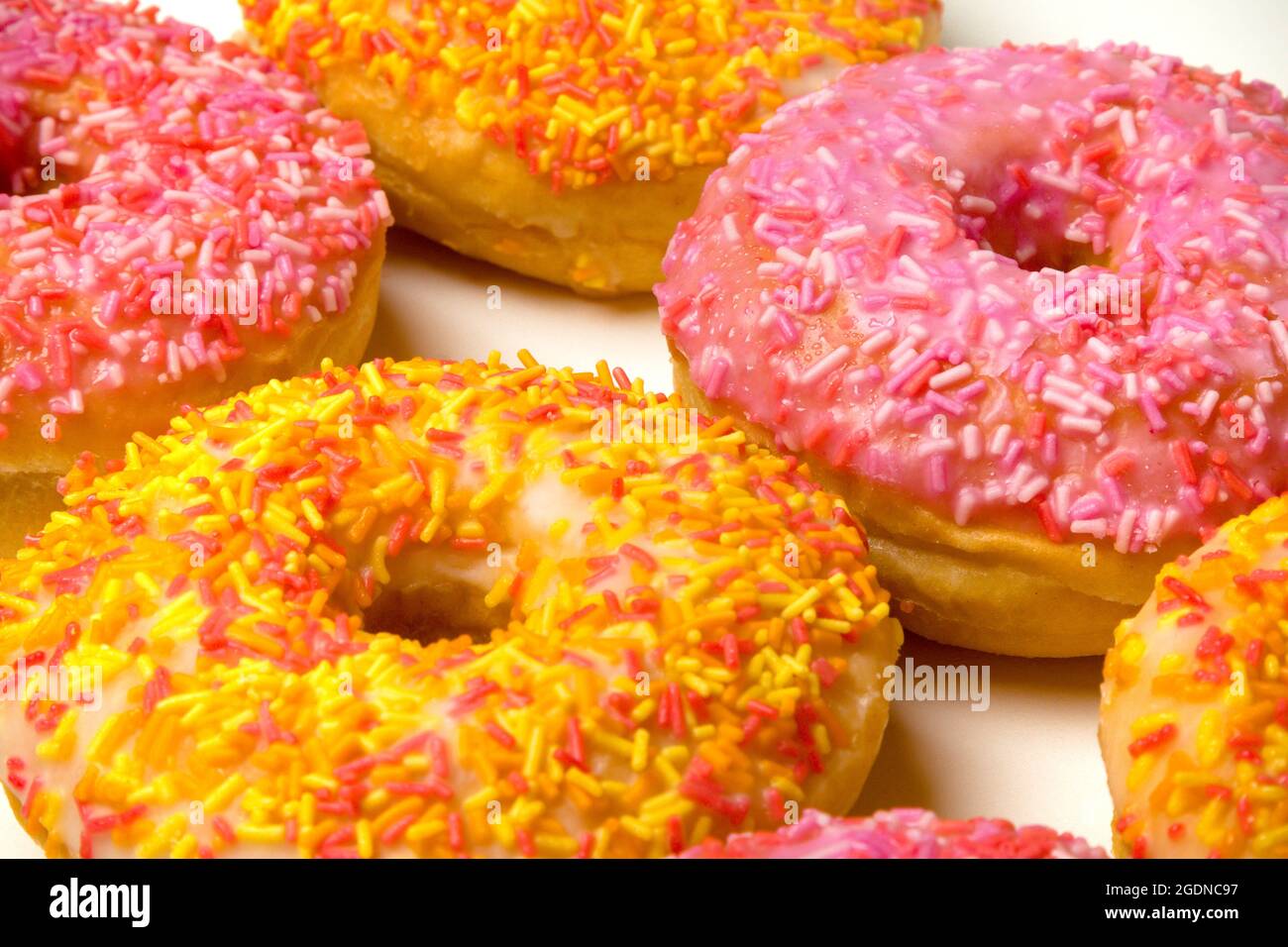 Iced Ring Donuts On A White Background Stock Photo - Alamy