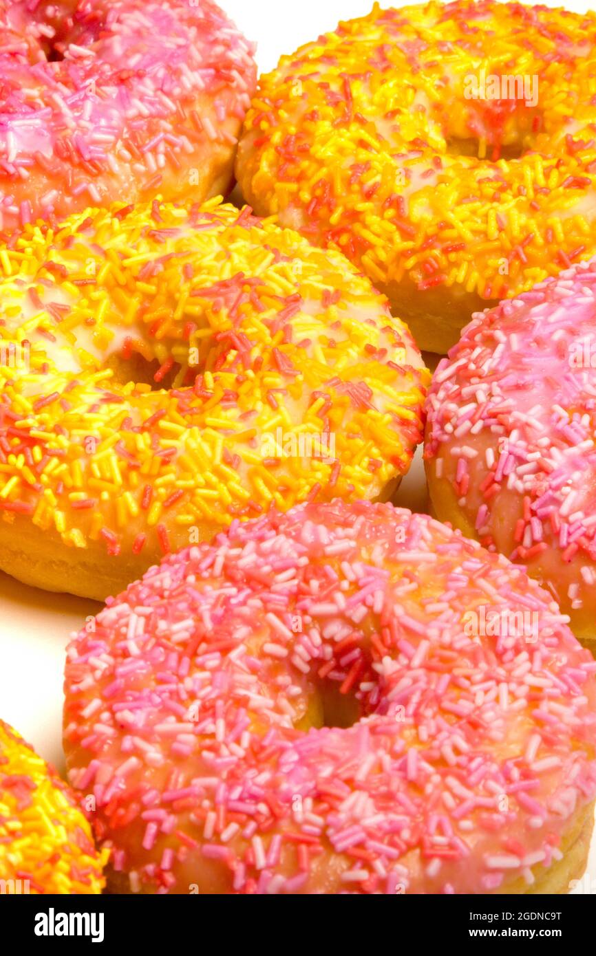 Iced Ring Donuts On A White Background Stock Photo - Alamy