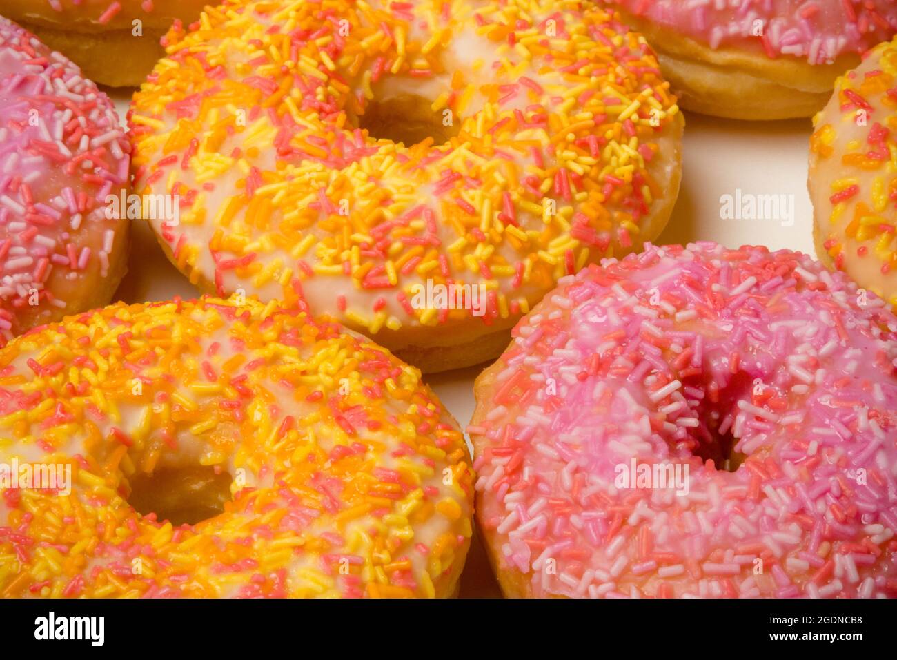 Iced Ring Donuts On A White Background Stock Photo - Alamy