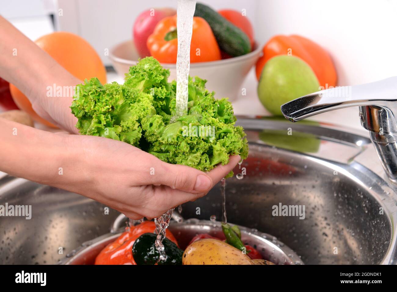 Washing fruits and vegetables close-up Stock Photo - Alamy