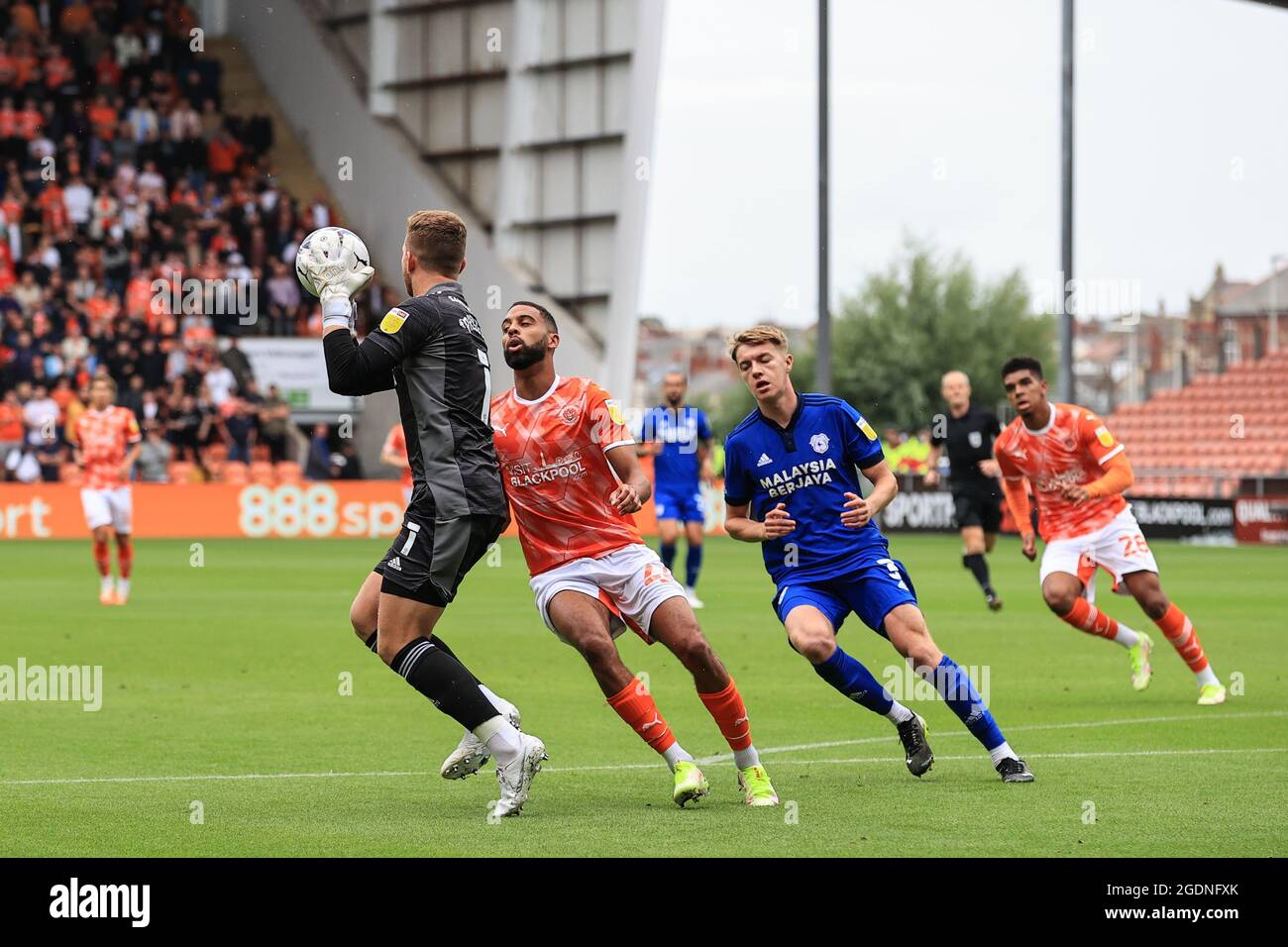 Dillon Phillips #1 of Cardiff City catches the ball as Cj Hamilton #22 ...