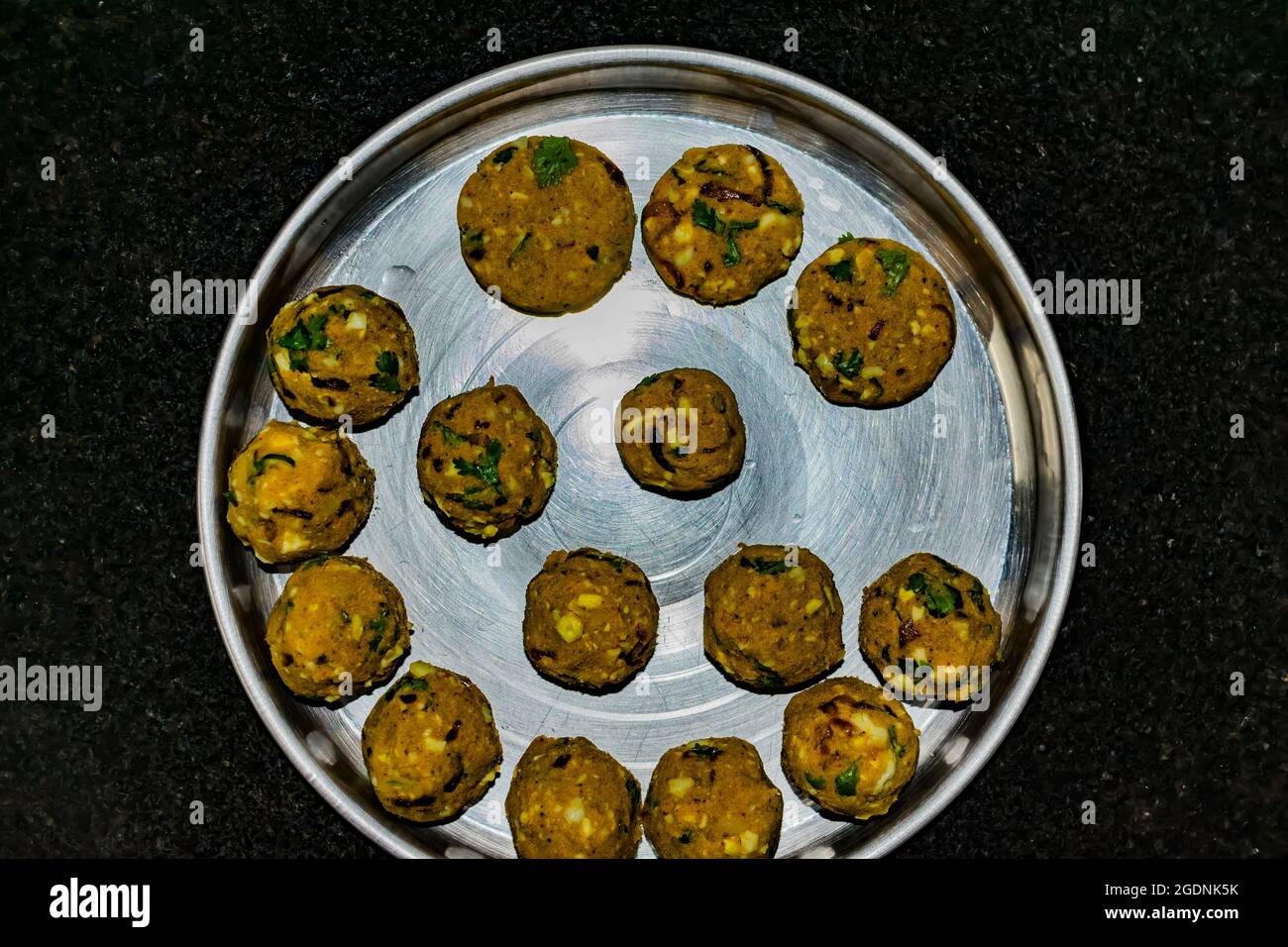 Indian red spicy snacks made with potato & Coccinia in home Stock Photo ...