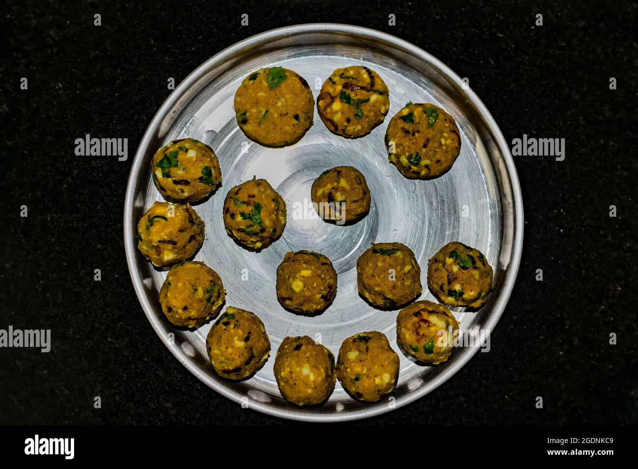 Indian red spicy snacks made with potato & Coccinia in home Stock Photo ...