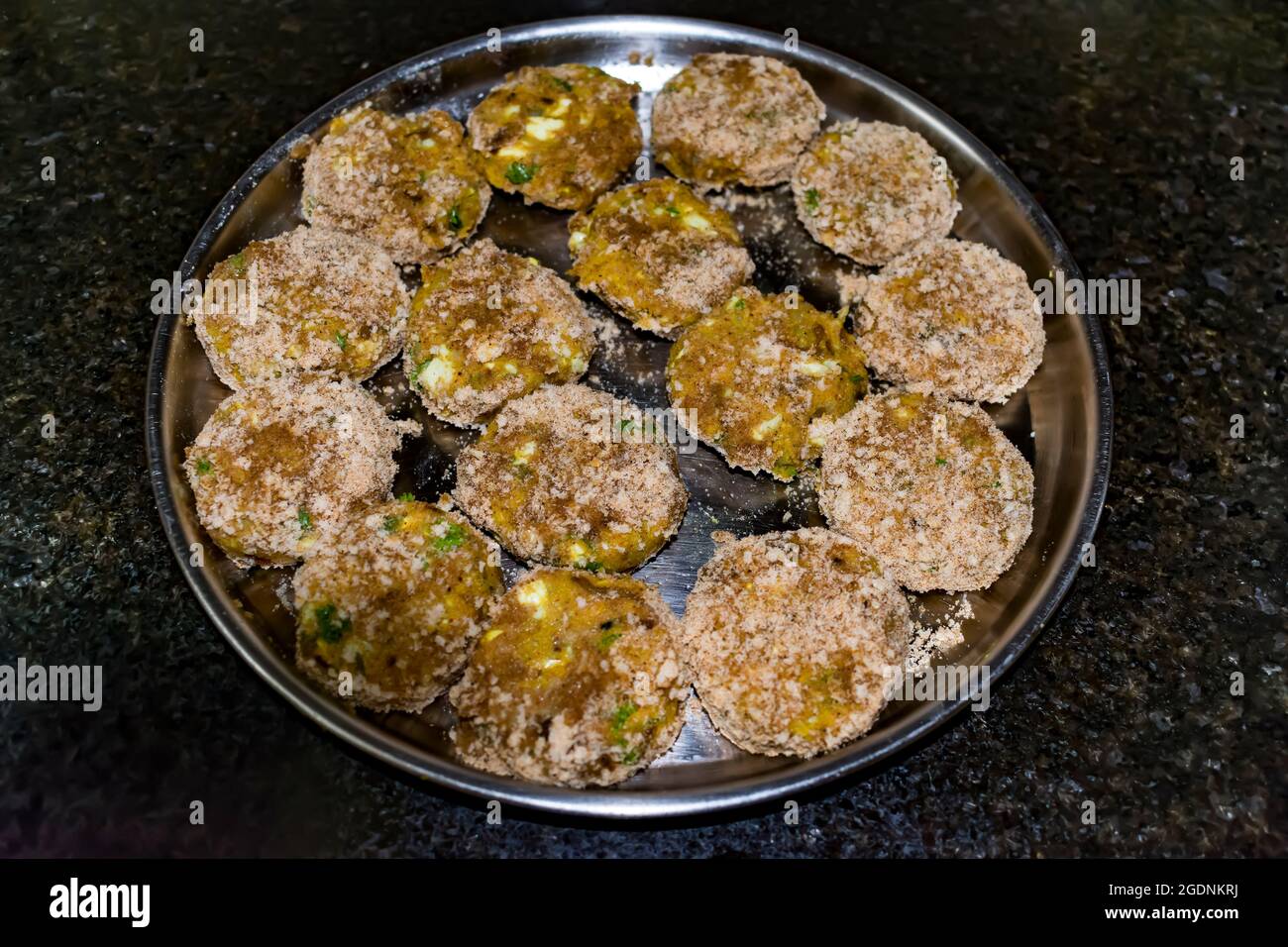 Indian red spicy snacks made with potato & Coccinia in home Stock Photo ...
