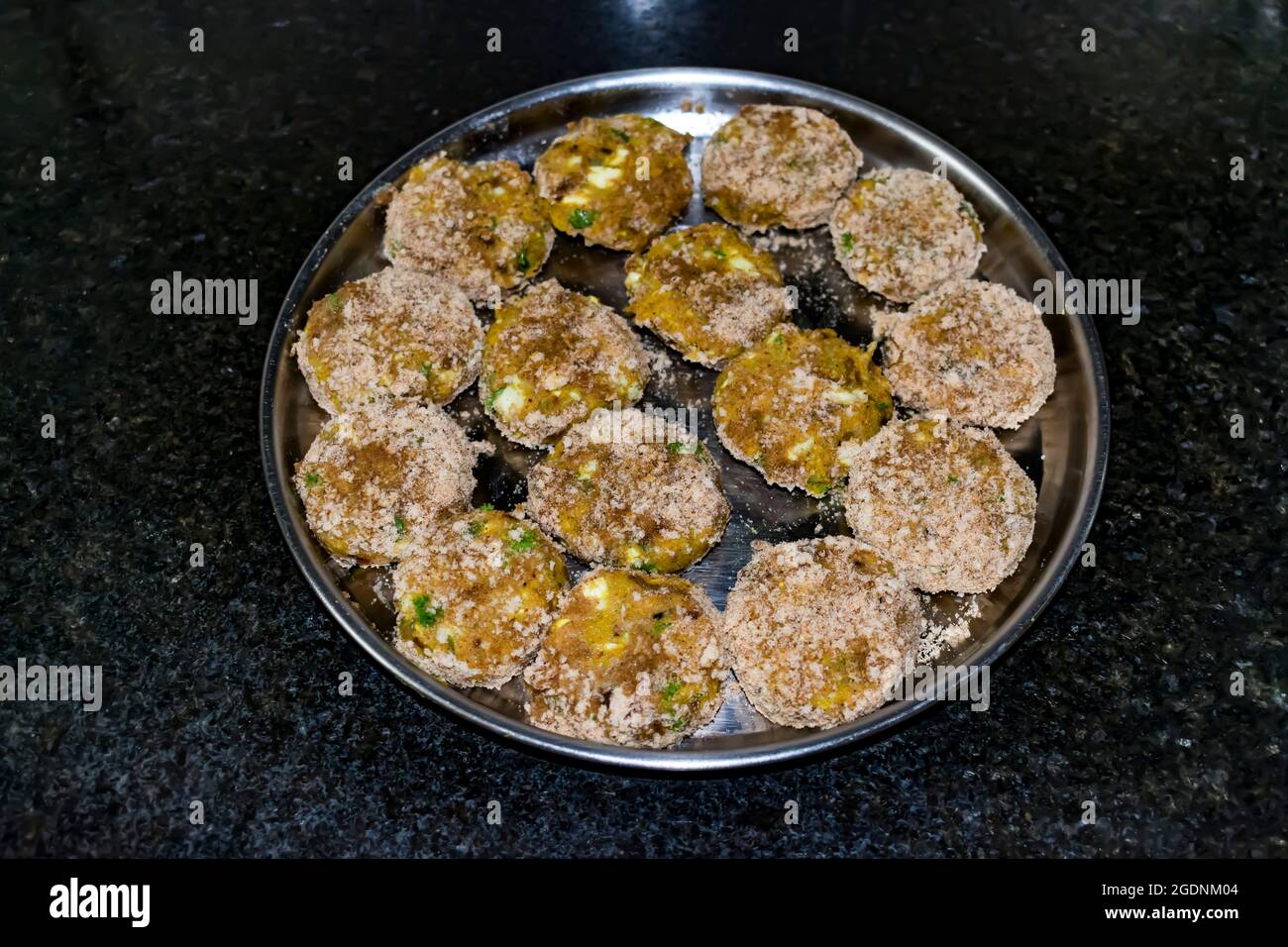Indian red spicy snacks made with potato & Coccinia in home Stock Photo ...