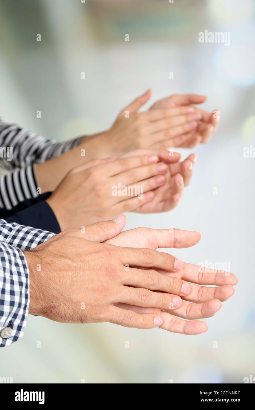 Clapping hands on bright background Stock Photo - Alamy