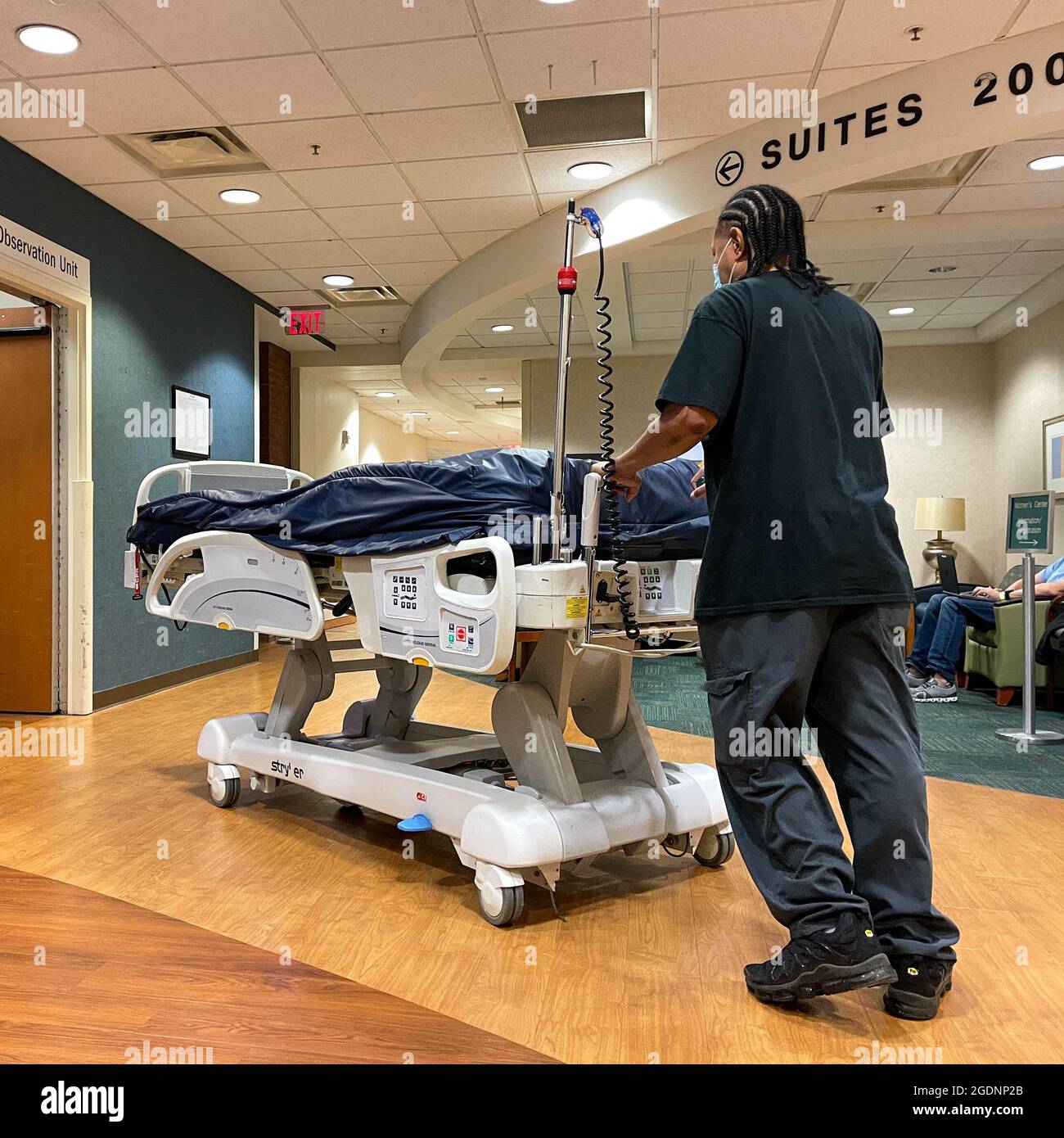 Atlanta, GA USA - March 26, 2021: A Piedmont Hospital worker moving a ...