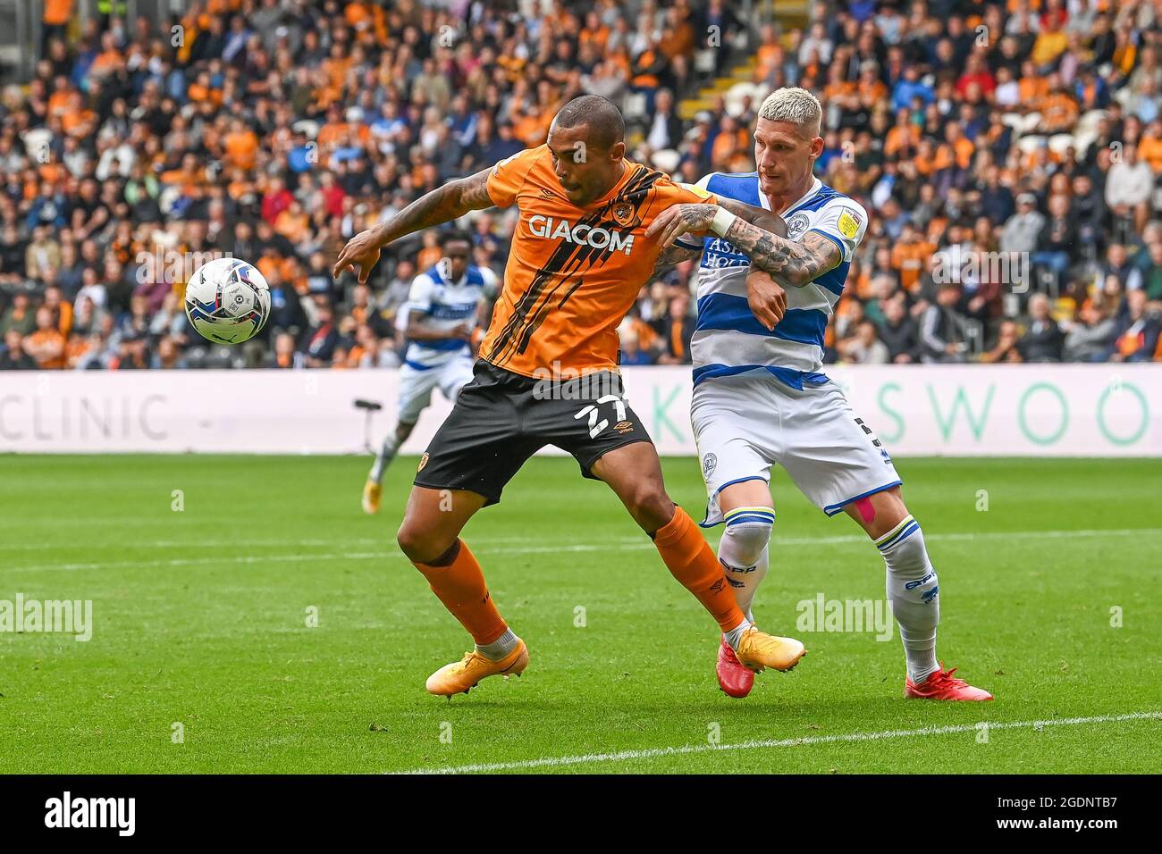 Josh Magennis #27 of Hull City holds off Jordy de Wijs #5 of Queens ...