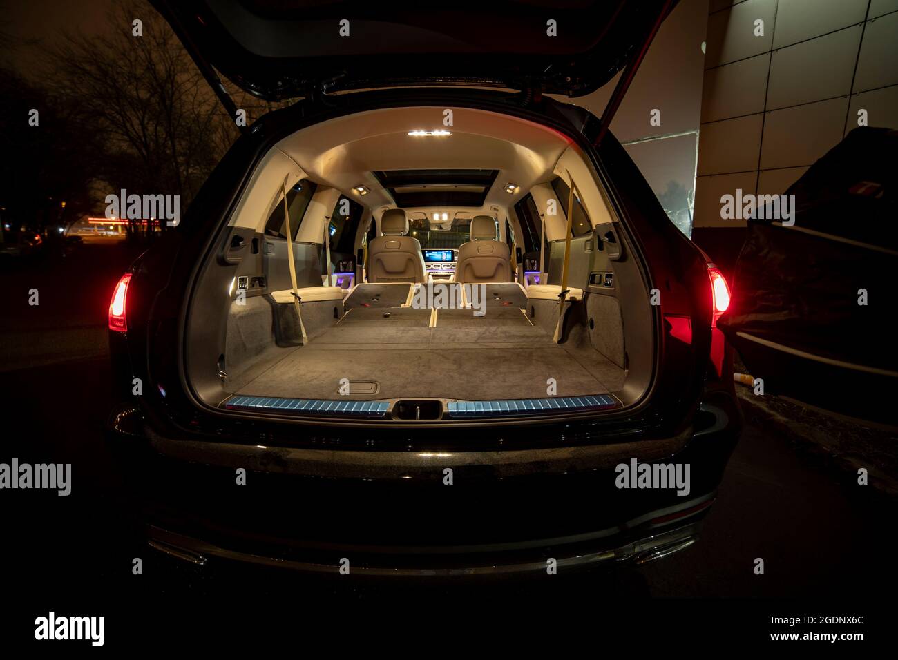 Moscow, Russia - December 24, 2019: The rear row of white leather seats ...