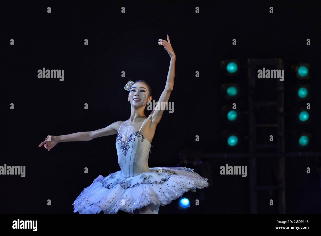 BUSAN, KOREA, SOUTH - Jun 26, 2019: A ballet dancer on a dark stage ...