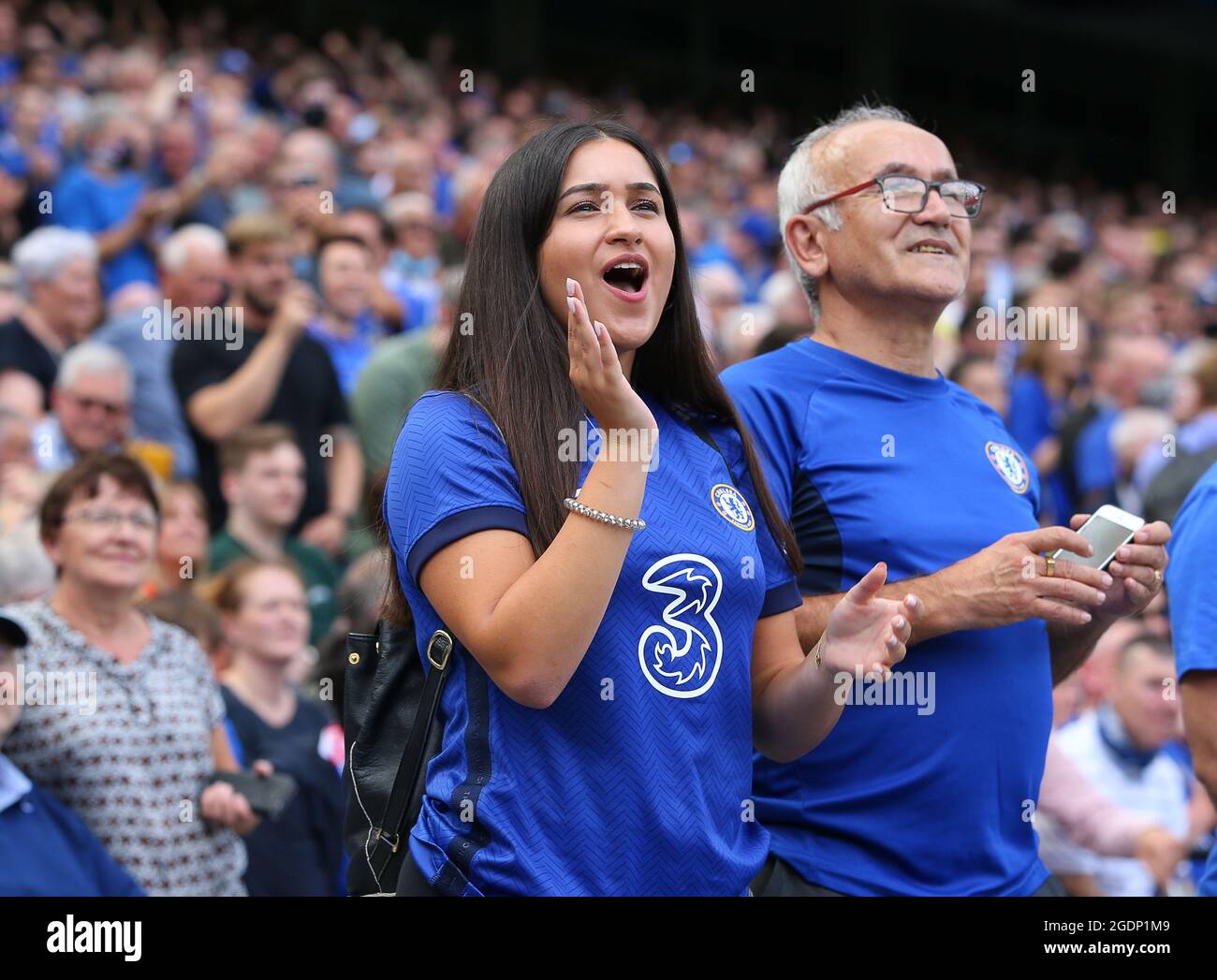 London, England, 14th August 2021. Chelsea fans cheer during the ...