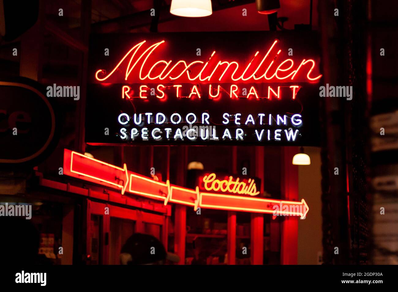 lighted neon sign of Maximilien restaurant at night in Seattle, USA ...