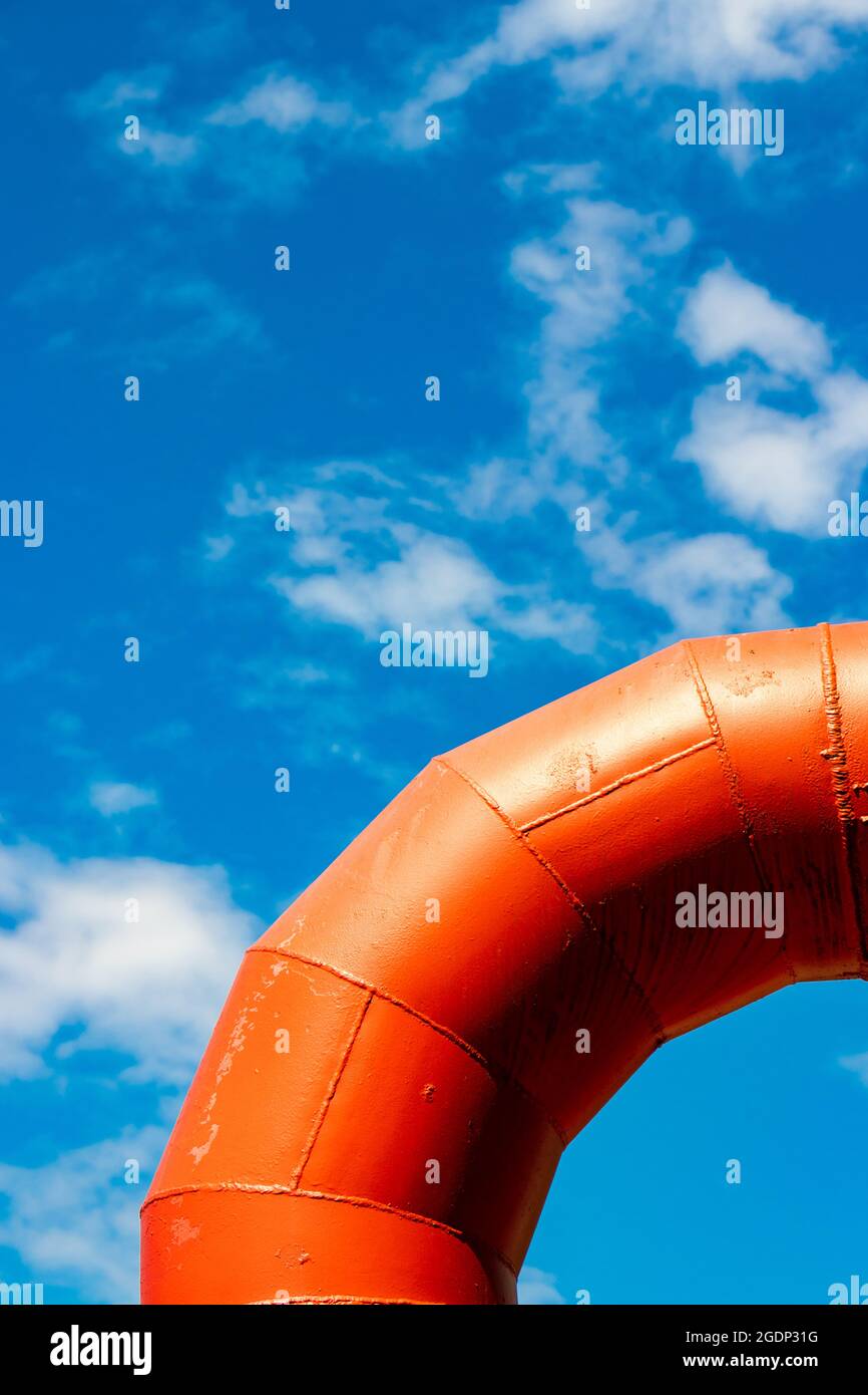 abstract concept of old red pipework in an elbow bend in Seattle, USA ...