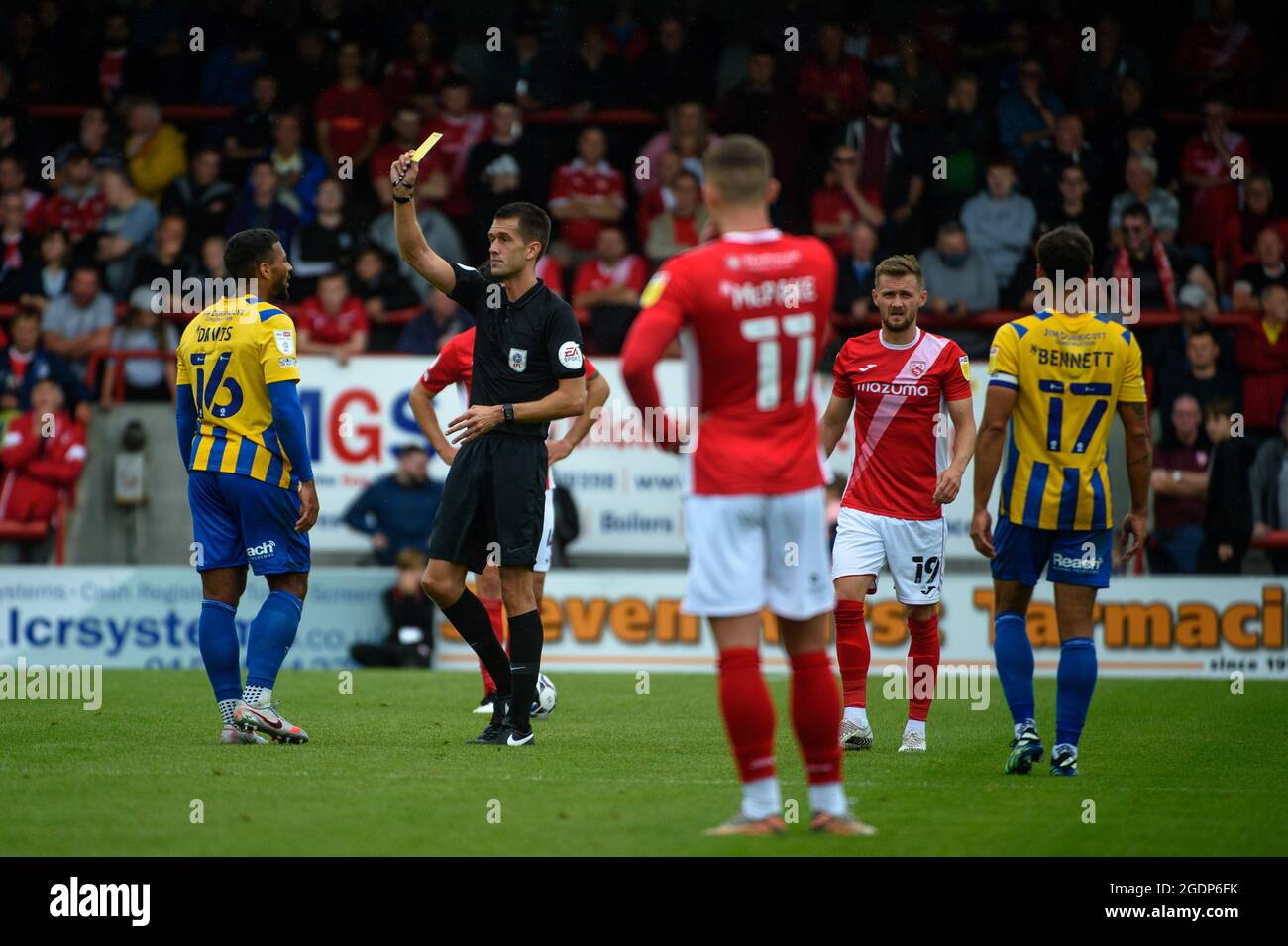 MORECAMBE, UK. AUGUST 14TH David Davis of Shrewsbury Town FC receives a ...