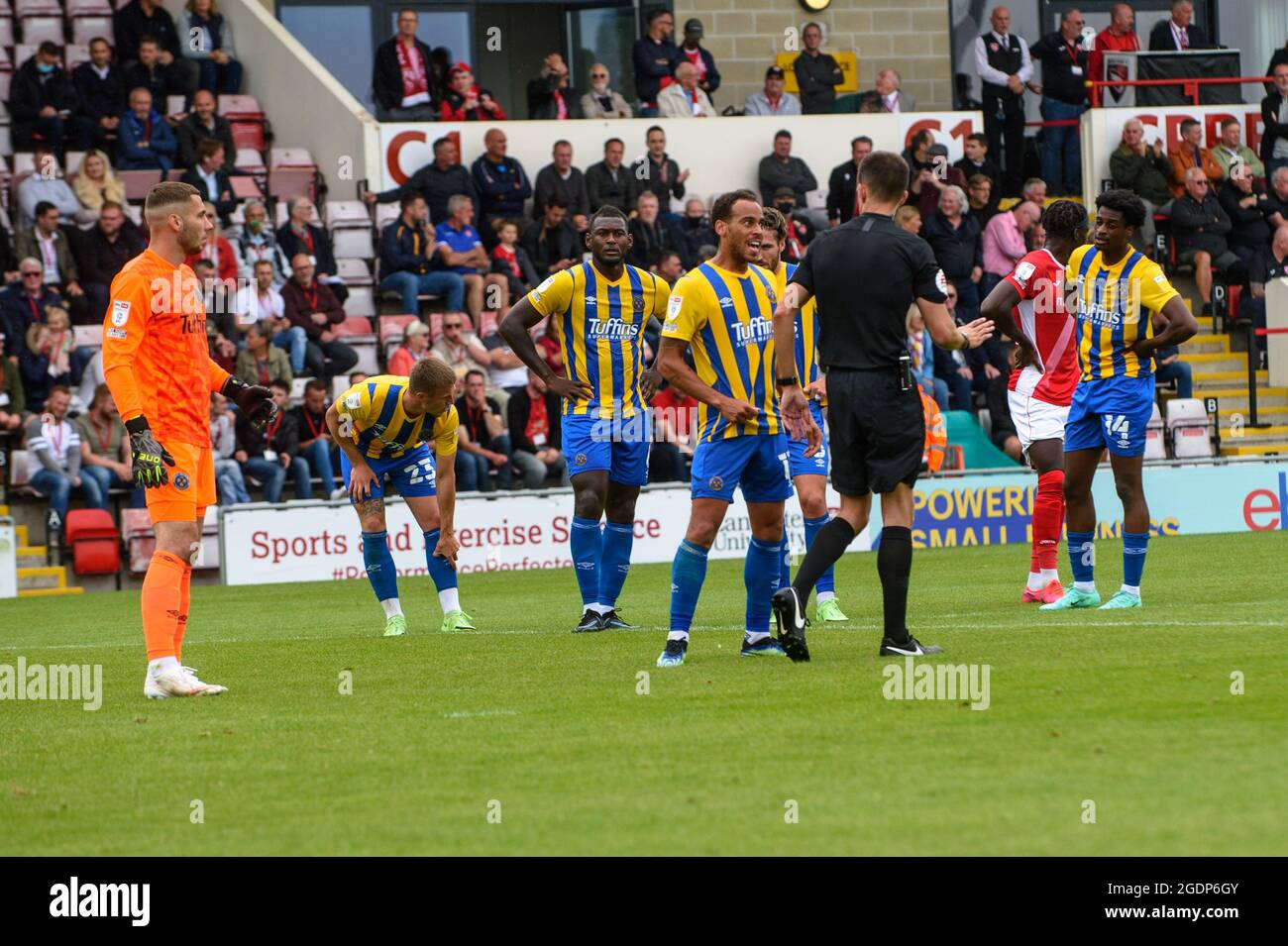 MORECAMBE, UK. AUGUST 14TH Referee Declan Bourne tells David Davis of ...