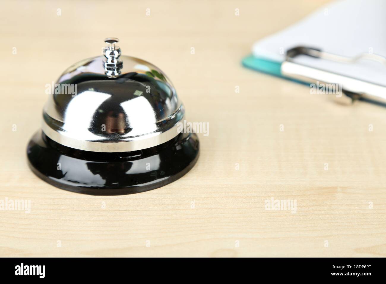 Reception bell on hotel reception desk, on bright background Stock ...