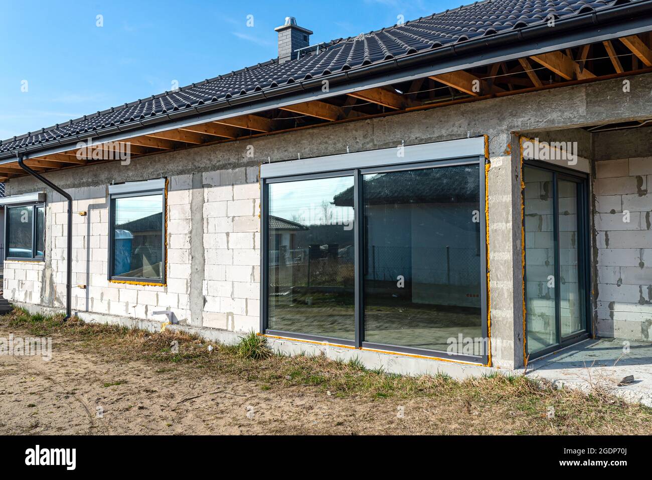 Newly installed not opened window with roller shutters in the house ...