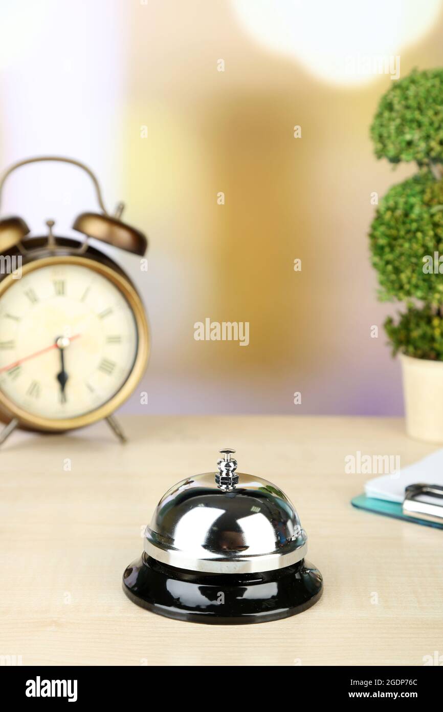 Reception bell on hotel reception desk, on bright background Stock ...