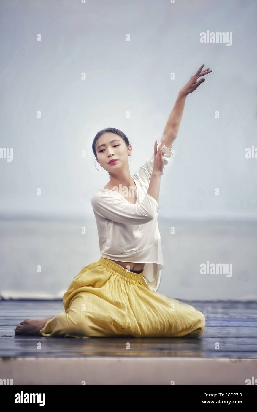 BUSAN, KOREA, SOUTH - Jun 26, 2019: A dancer in a costume performing on ...