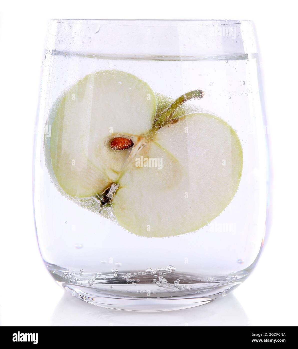Apple in glass of water isolated on white Stock Photo - Alamy