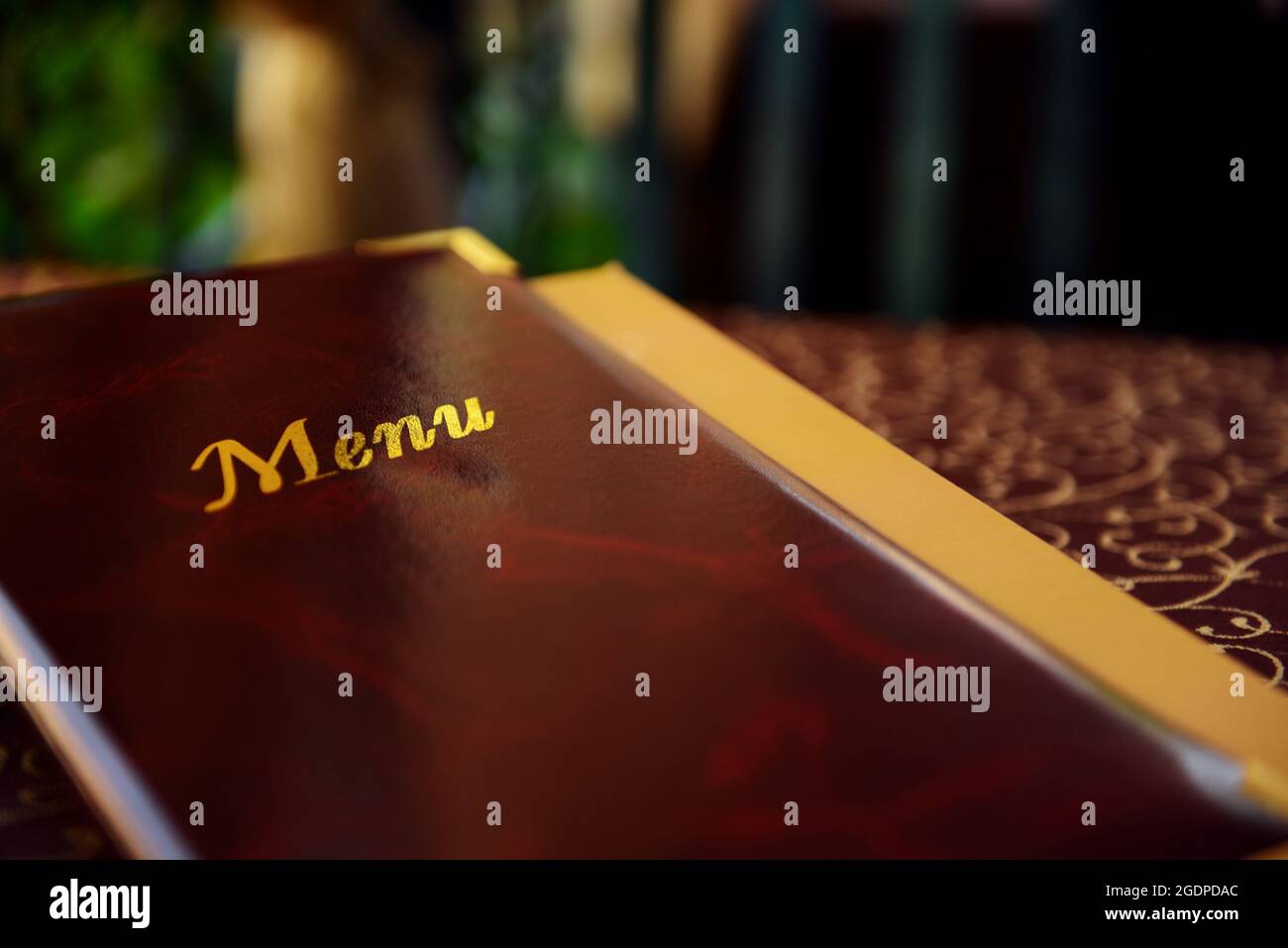 Menu book on table in restaurant Stock Photo - Alamy