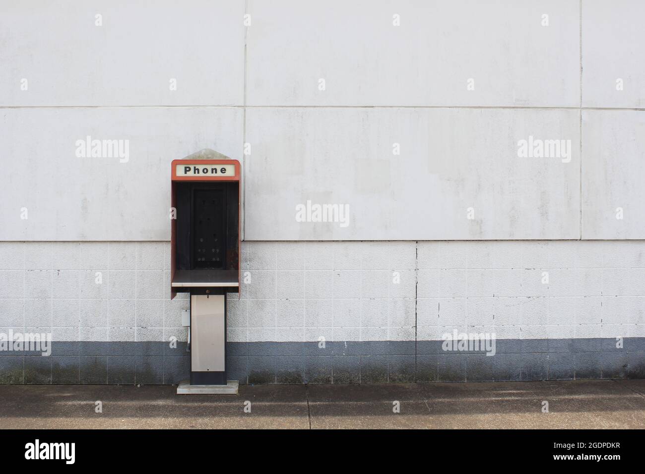Broken Phone Booth on Wall of Abandoned Building Stock Photo - Alamy