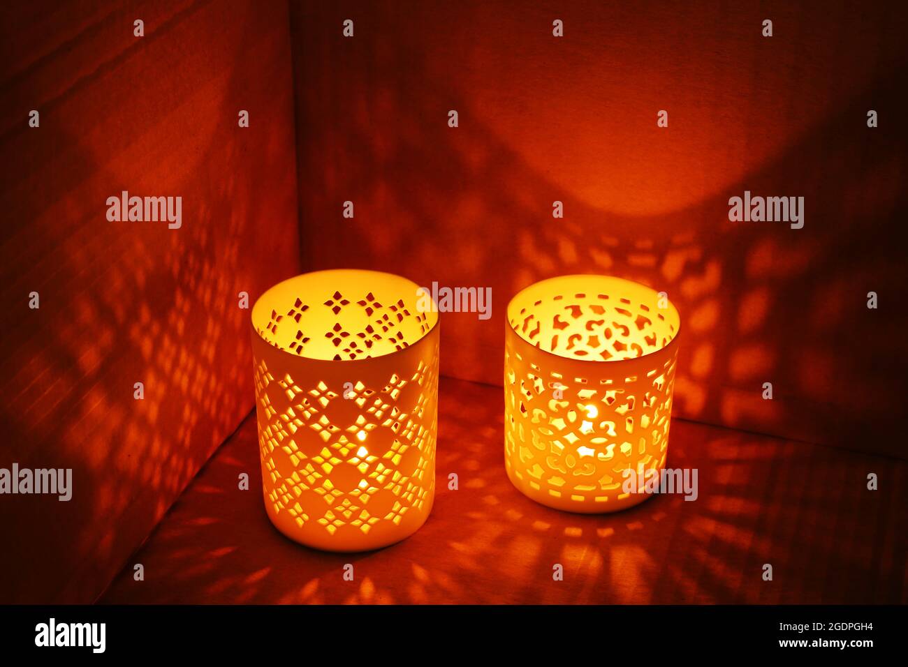 Lantern casts shadows on wall Stock Photo - Alamy