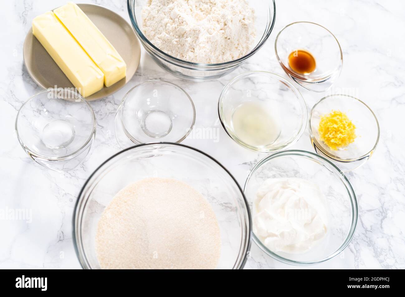 Ingredients in a glass mixing bowls to bake a lemon pound cake Stock ...