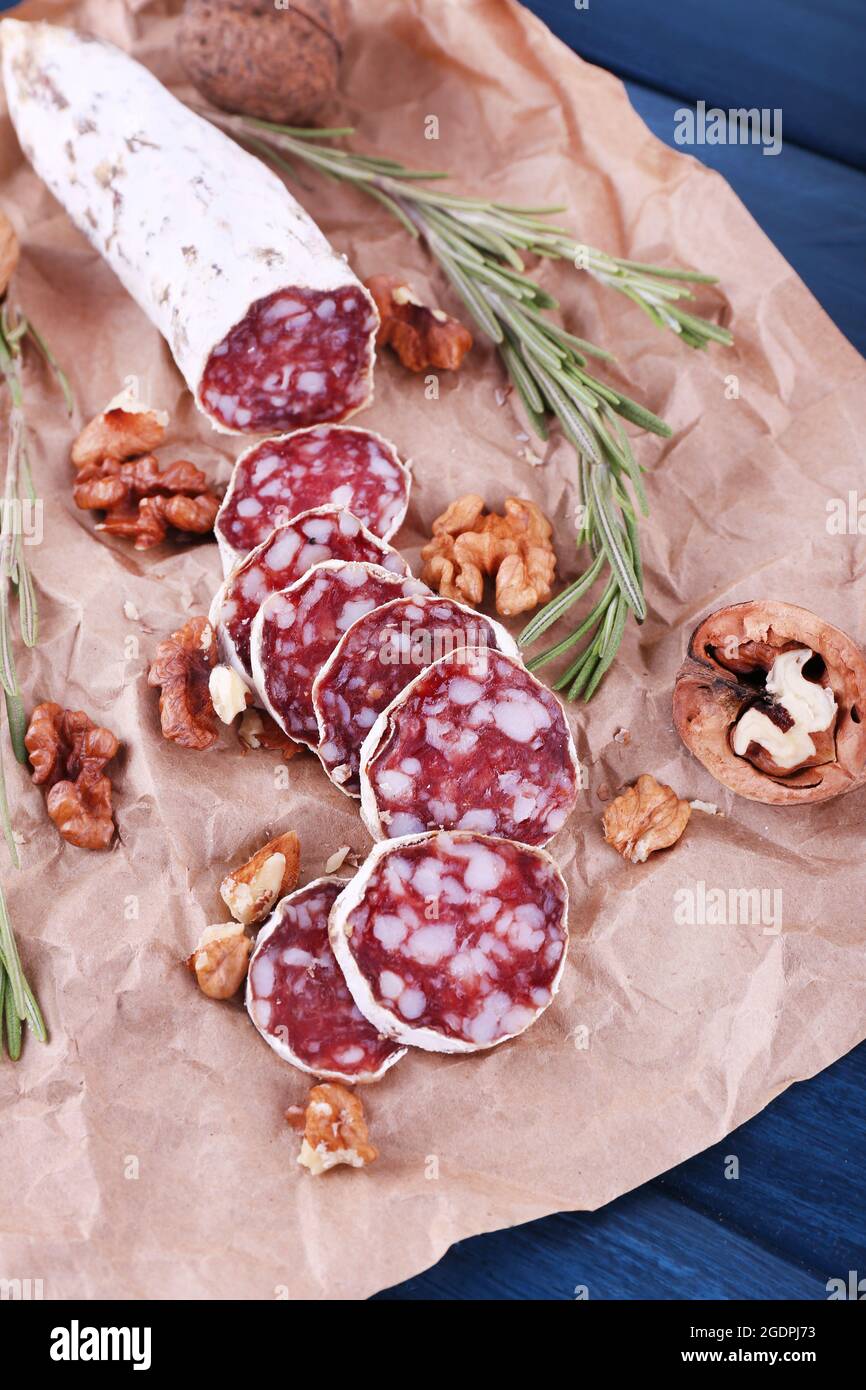 French salami and walnuts on craft paper background Stock Photo - Alamy
