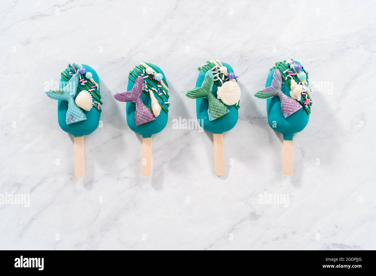 Mermaid cakesicles with drizzled chocolate, chocolate mermaid tails ...