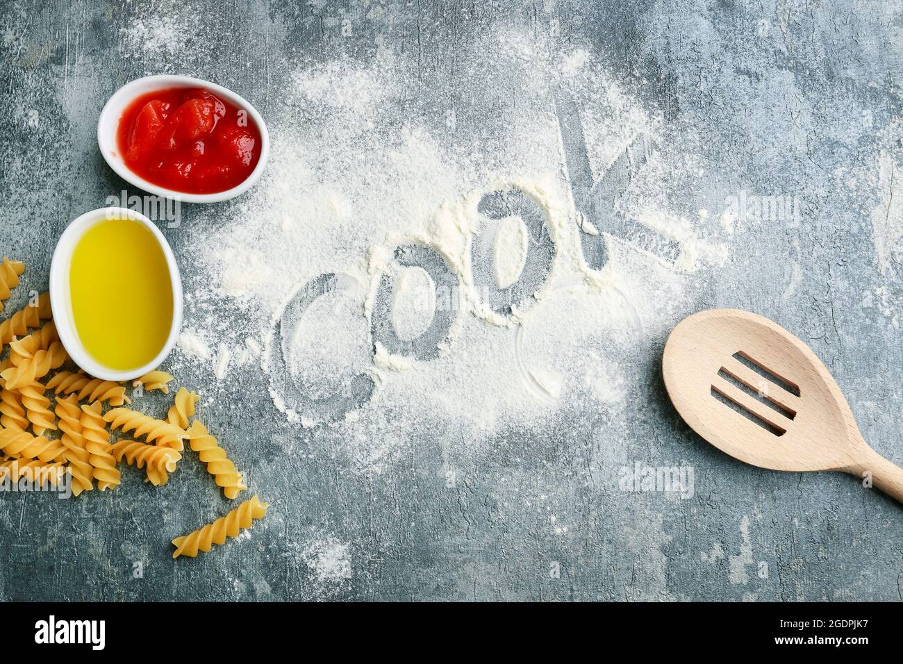 Handwritten word cook on grey stone background. Kitchen ideas Stock ...