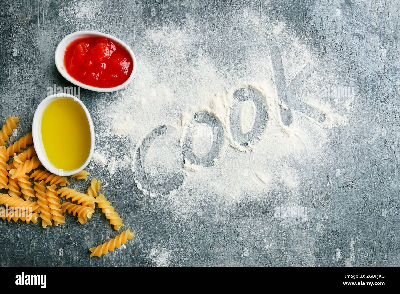 Handwritten word cook on grey stone background. Kitchen ideas Stock ...