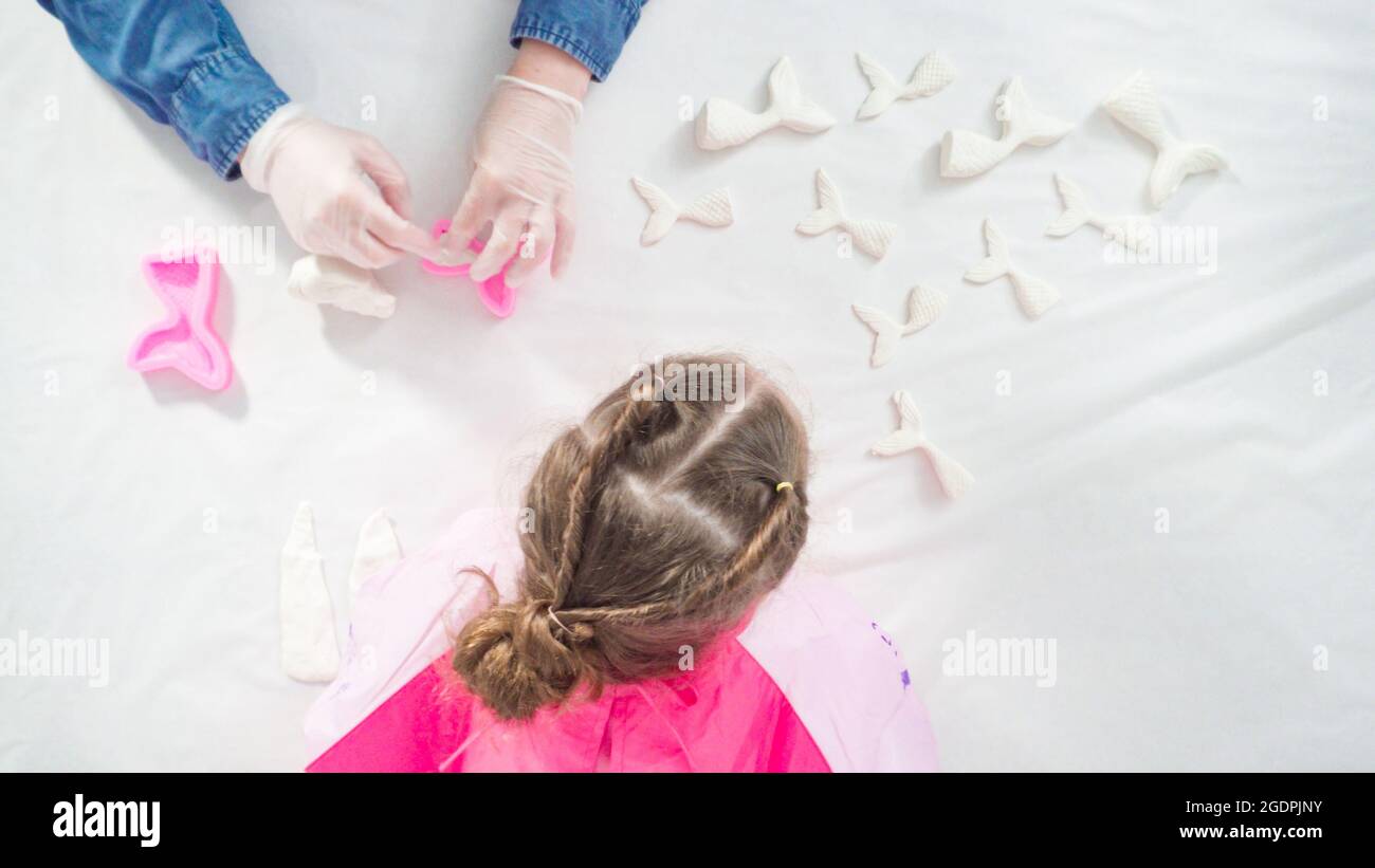 Flat lay. Step by step. Making mermaid tail from modeling clay in ...