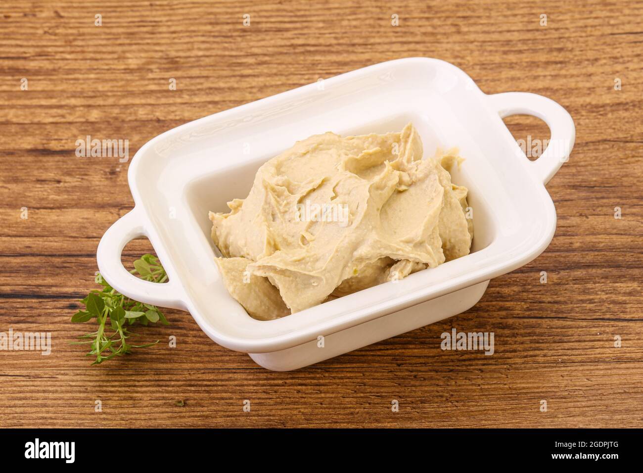 Vegan food - hummus dip with olive oil Stock Photo - Alamy