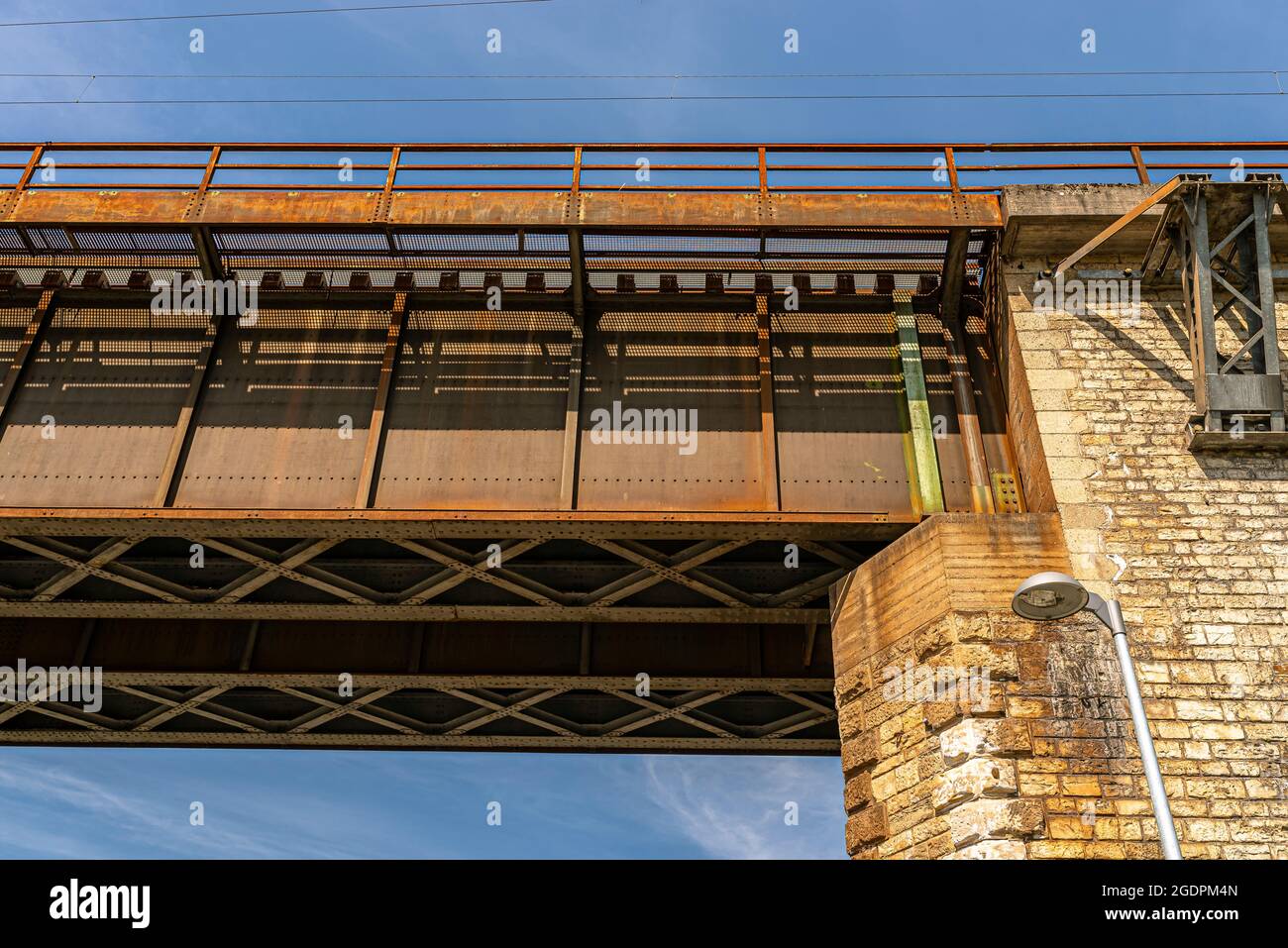 The steel lattice structure of the railway bridge viewed from below ...