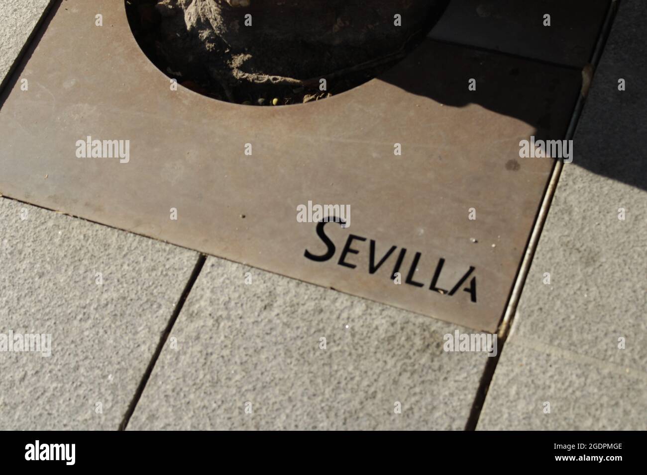 Closeup of an inscription of the Spanish name of the city of Seville ...